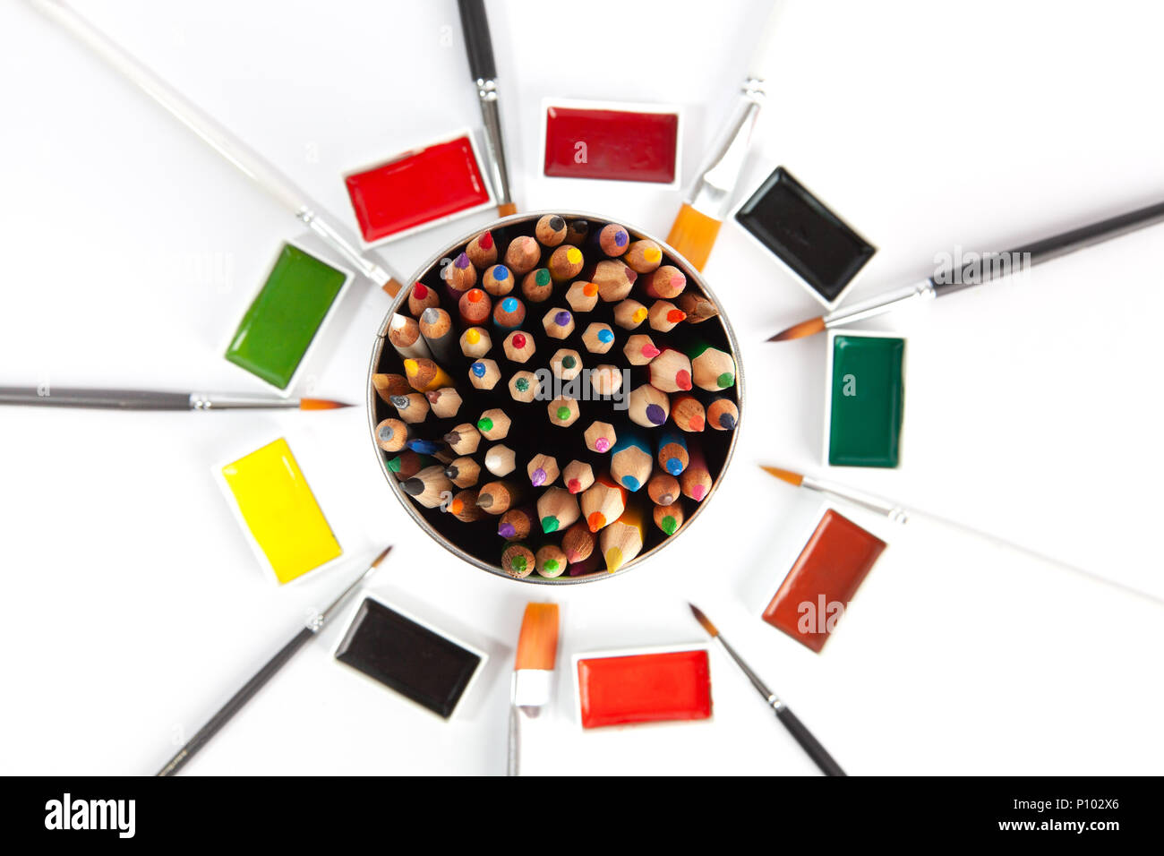 Various colorful art supplies - top view on white background with focus ...