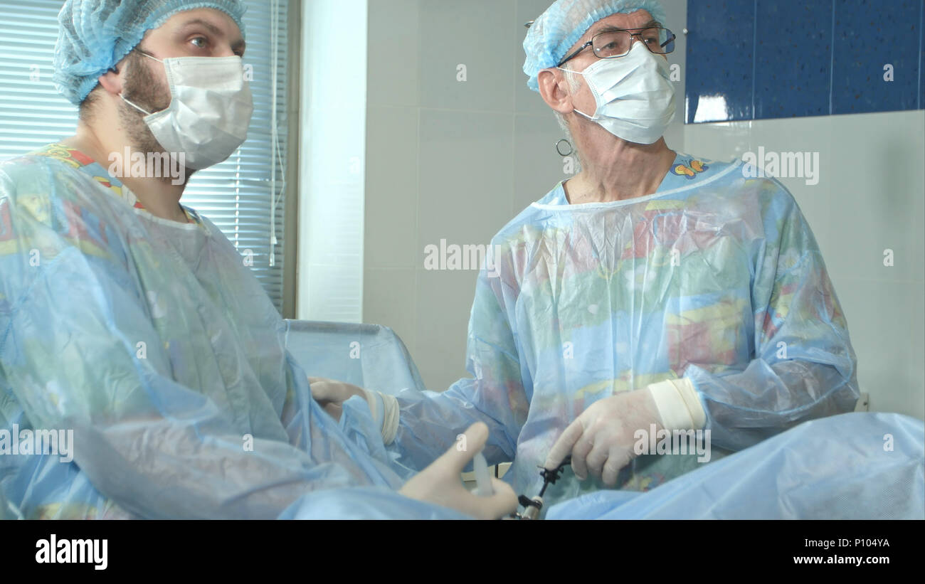 Two surgeons operating in hospital Stock Photo - Alamy