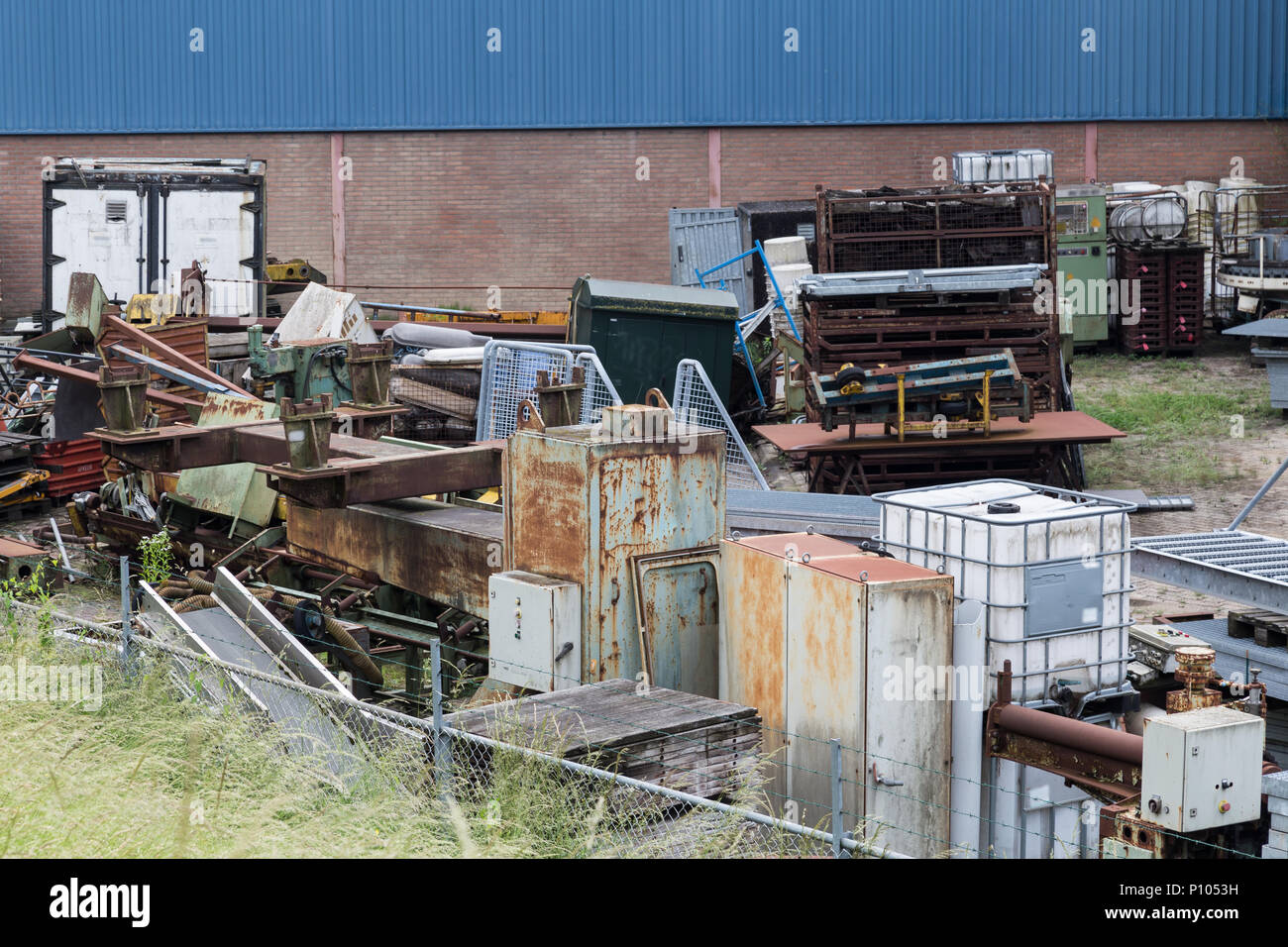 Reusable waste machinery from old factories Stock Photo - Alamy