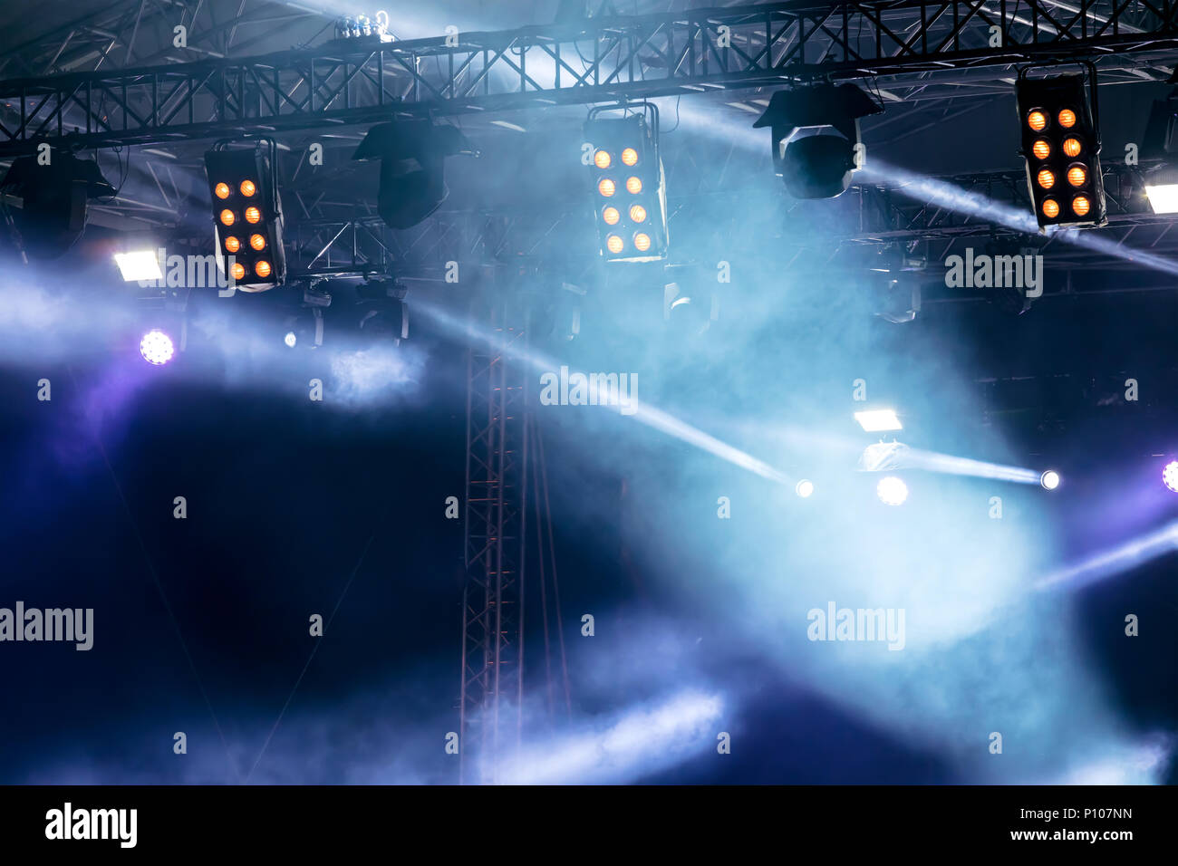 stage lights during a rock concert. blue lightning and smoke Stock ...