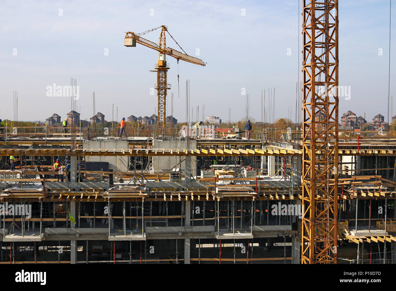 building construction site with workers and cranes industry Stock Photo ...