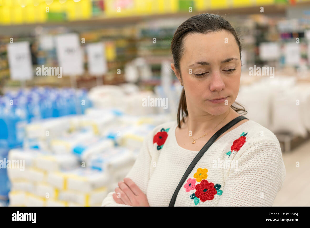 Sad woman in the store Stock Photo - Alamy
