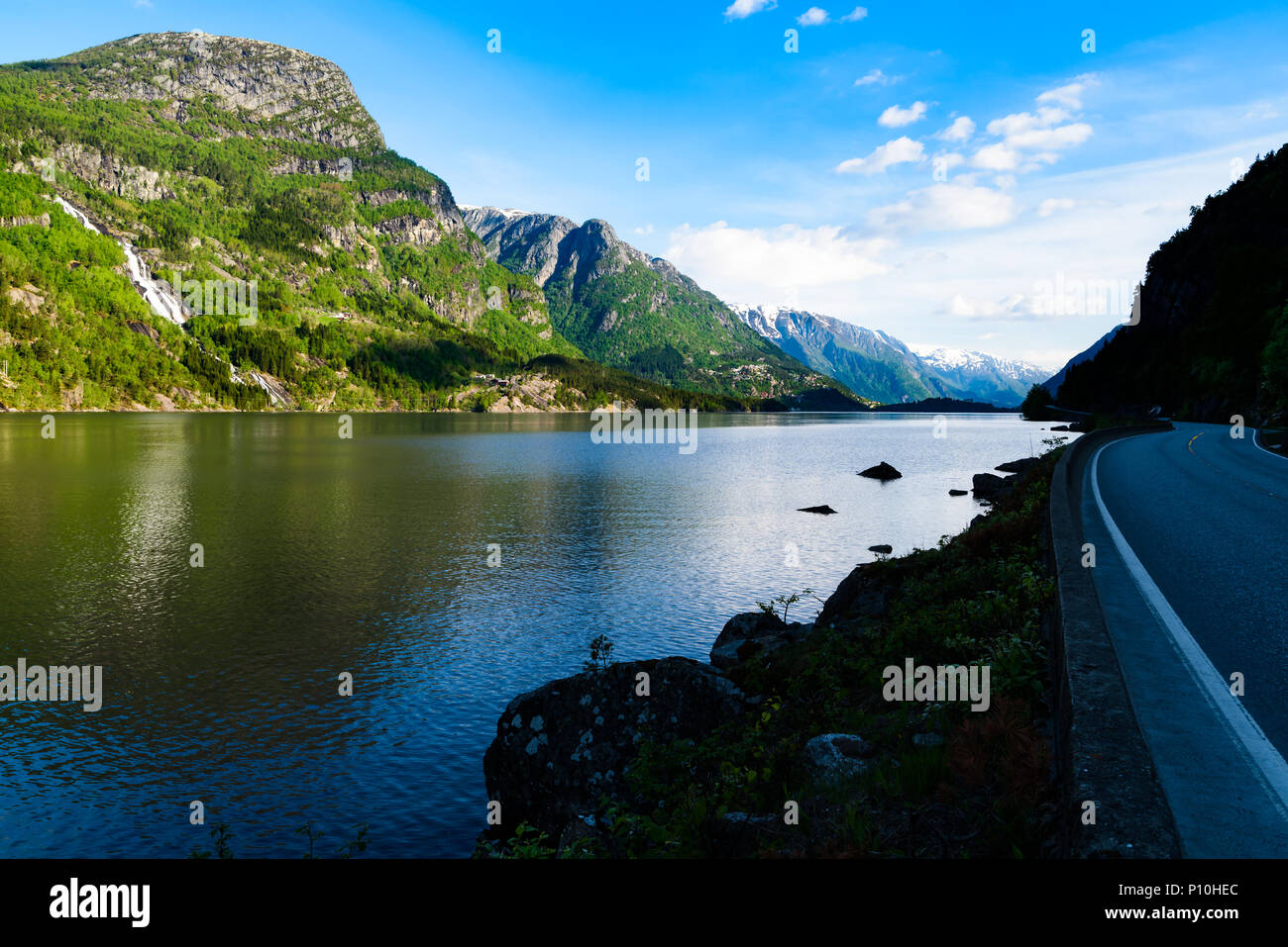 View over lake Sandevatnet along road 13 on a sunny and calm morning ...
