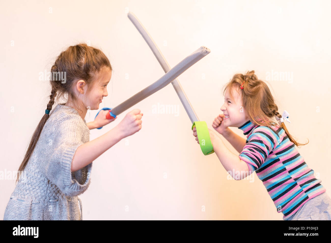 Two girls fight toy hi-res stock photography and images - Alamy