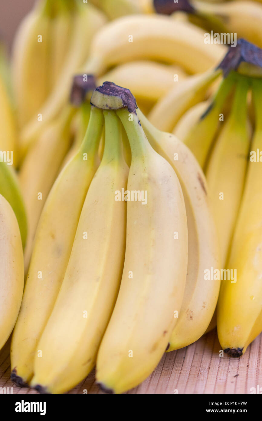 Bunch of bananas on boxes in supermarket. yellow bananas in a ...