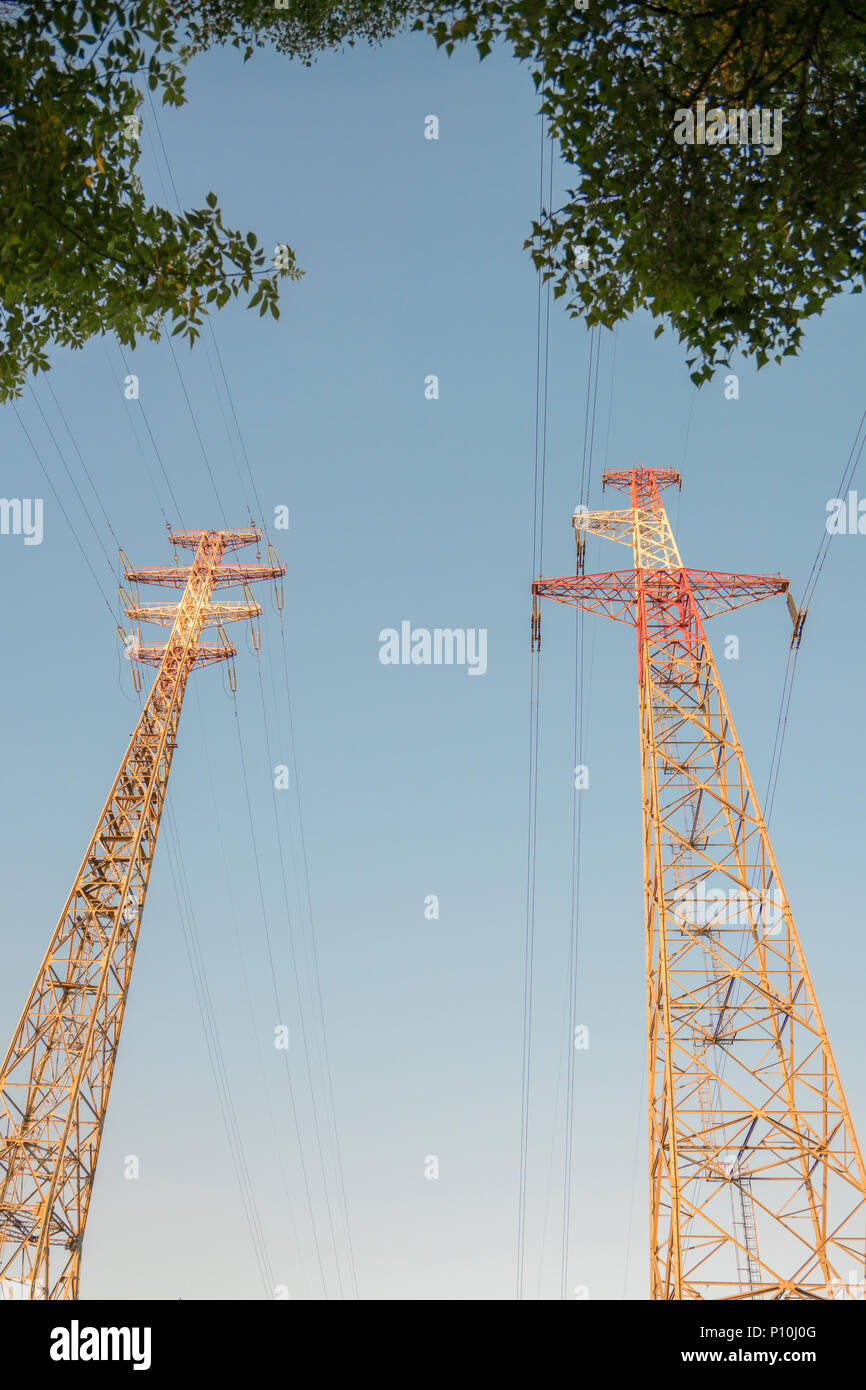 Two large rectangular high-voltage electrical transmission towers with ...