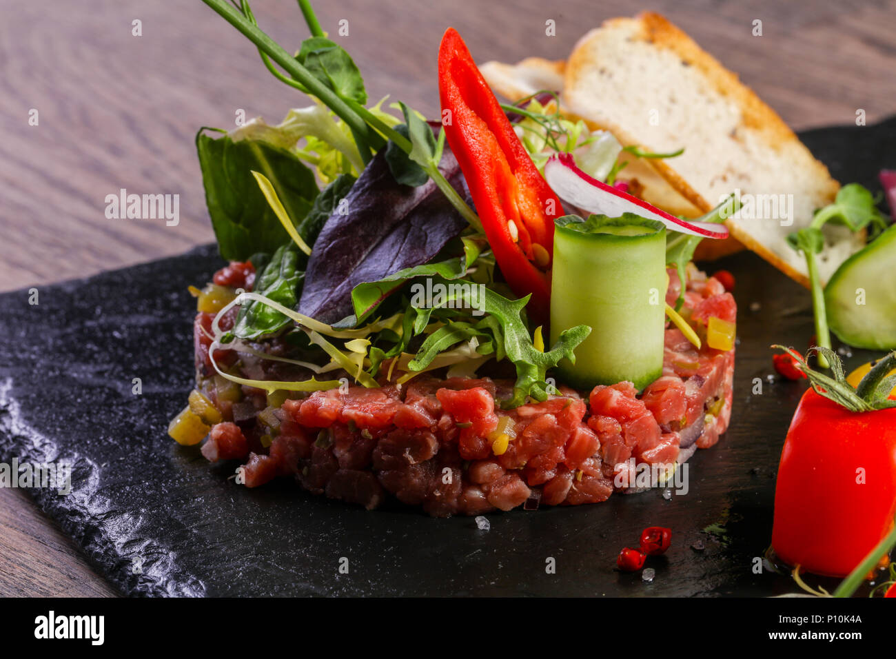 Raw beef tartar served quail egg Stock Photo - Alamy