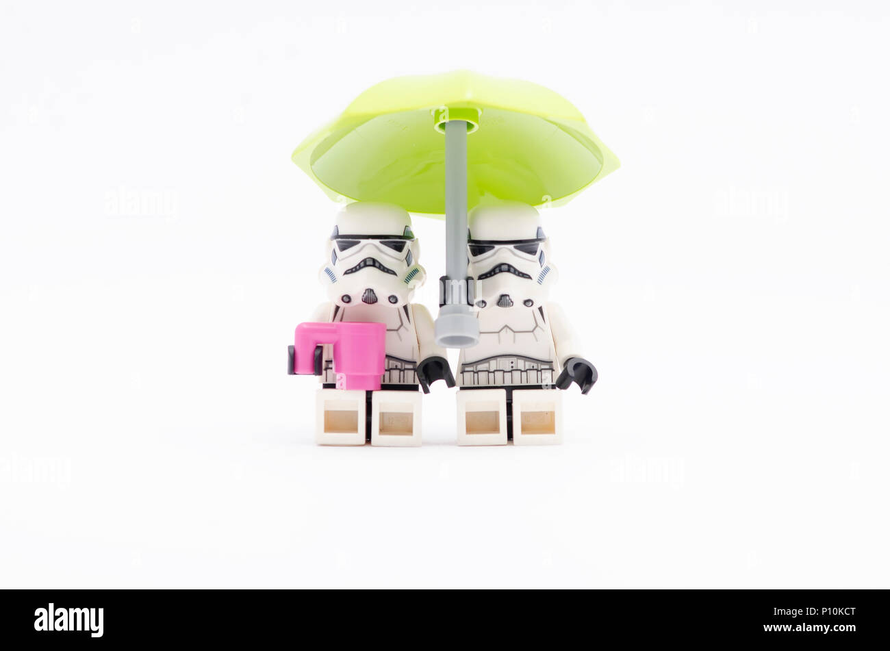 mini figure of storm trooper having a drink with one of them watching ...