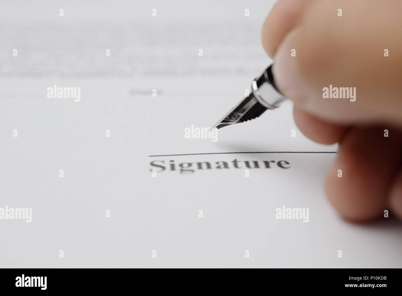 Signing a form, closeup Stock Photo - Alamy