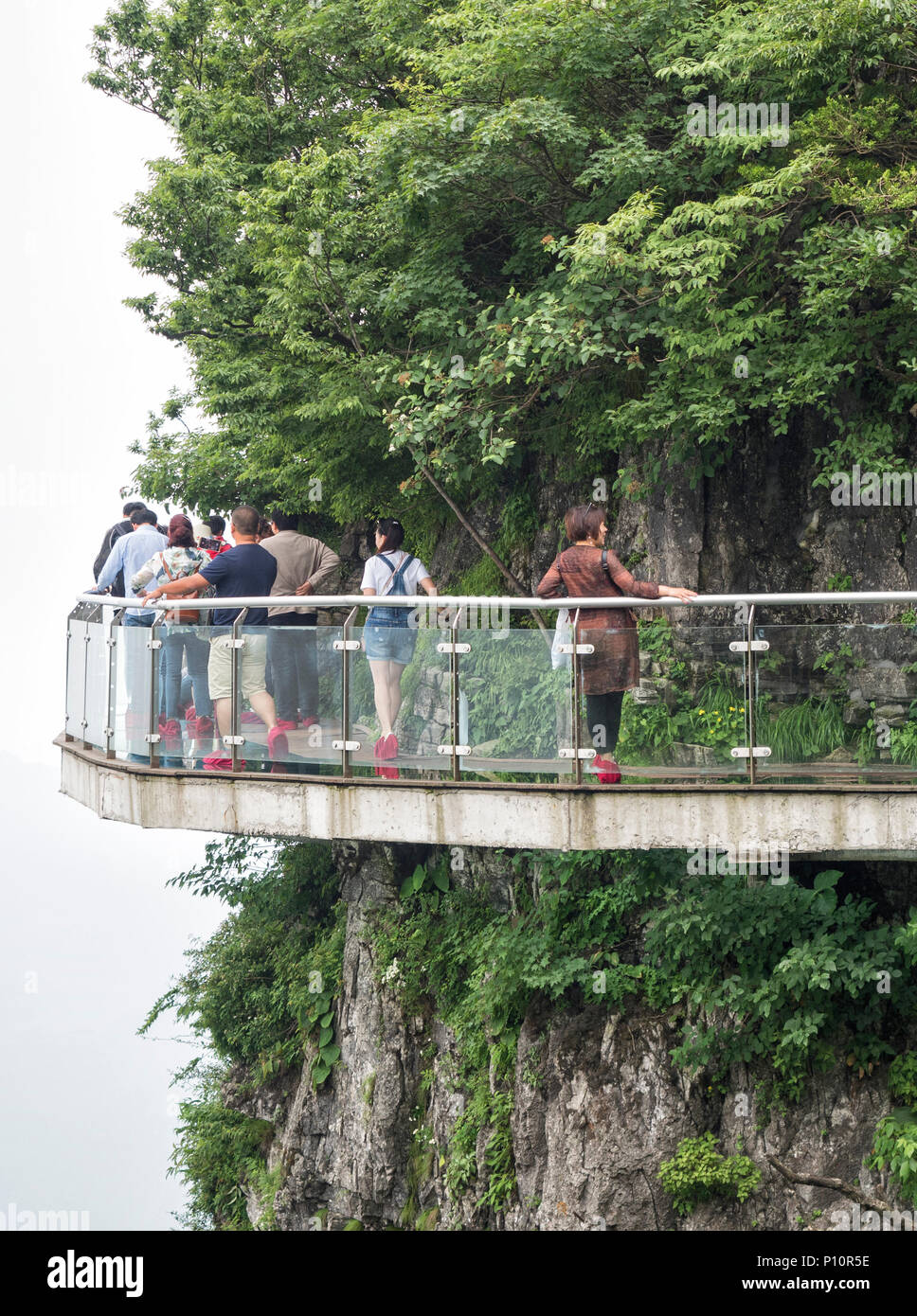 28 May 2018: Tourists walking at The Bridge at Tianmen Mountain, The ...