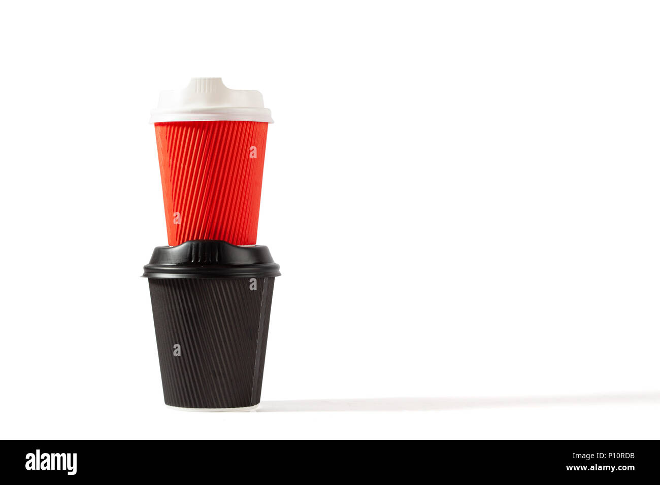 Red and black plastic coffee cups stacked on top of each other isolated ...