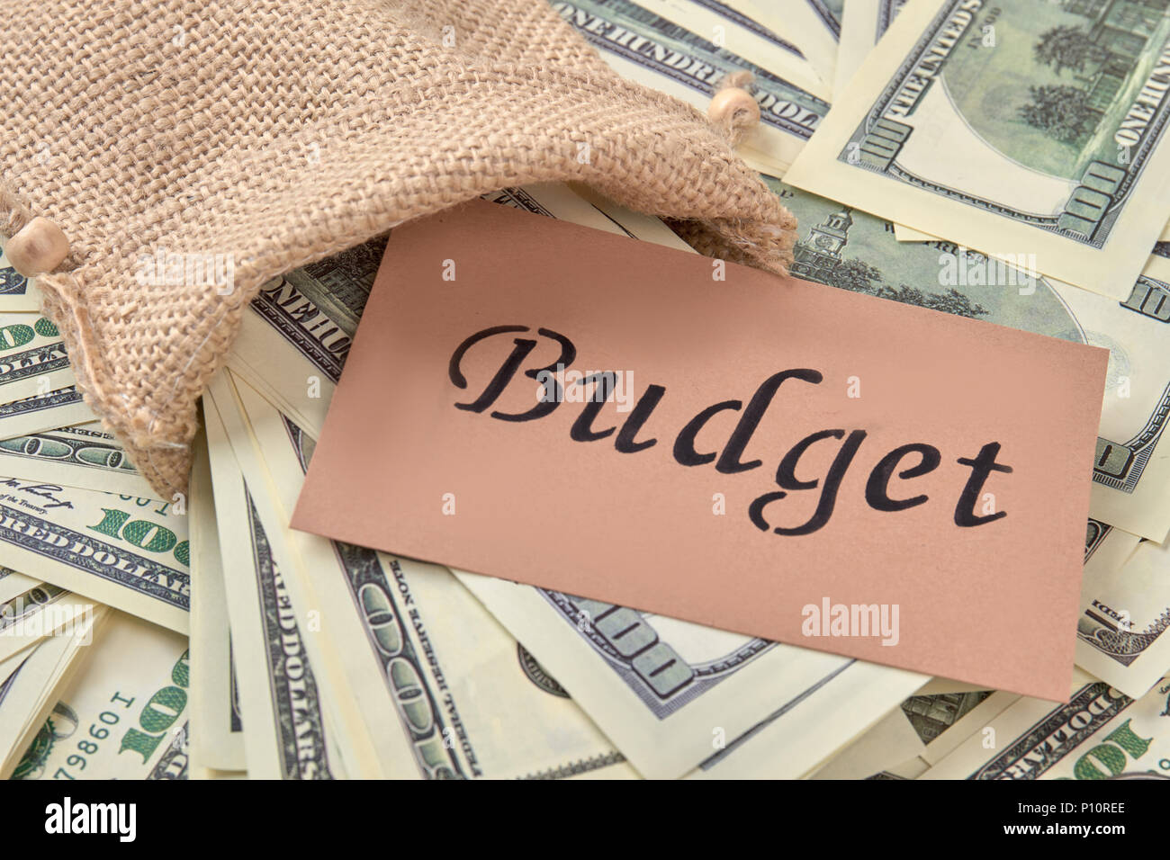 Budget concept, pile of money and bag. Close up. Top view Stock Photo ...
