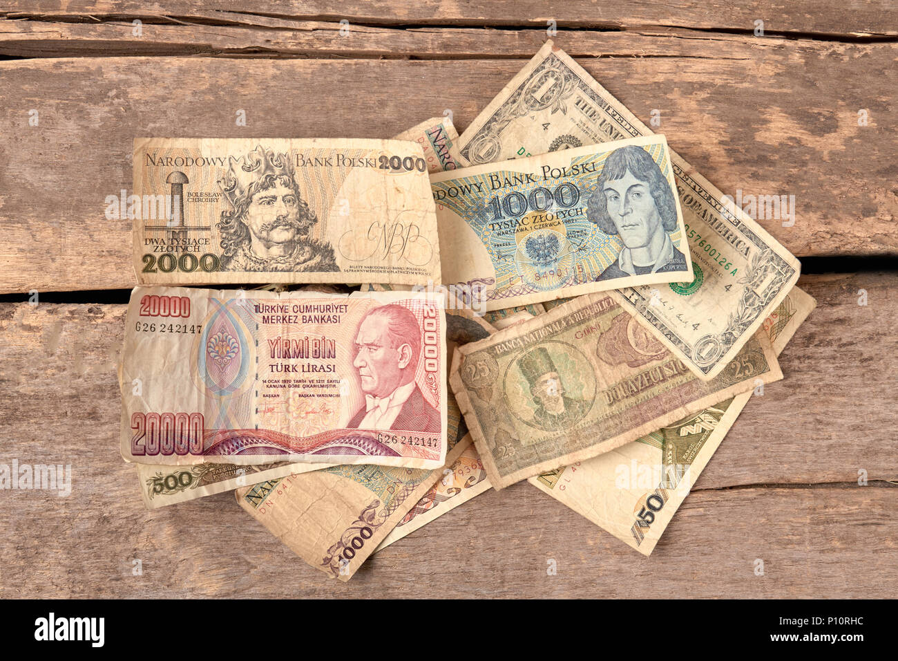 Colorful old world paper money Wooden desk background Stock Photo - Alamy