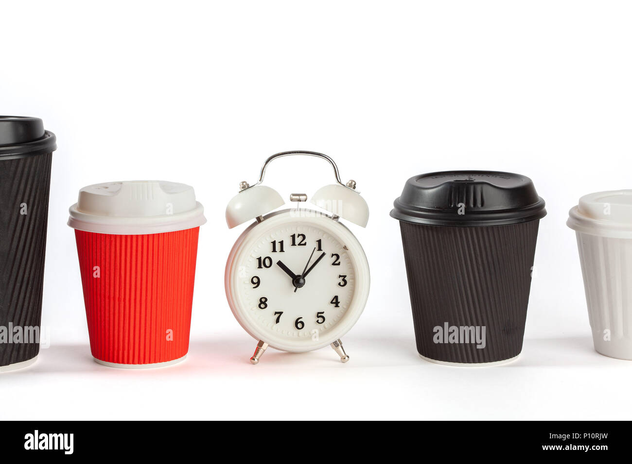 Coffee time concept with vintage alarm clock and disposable coffee cups ...