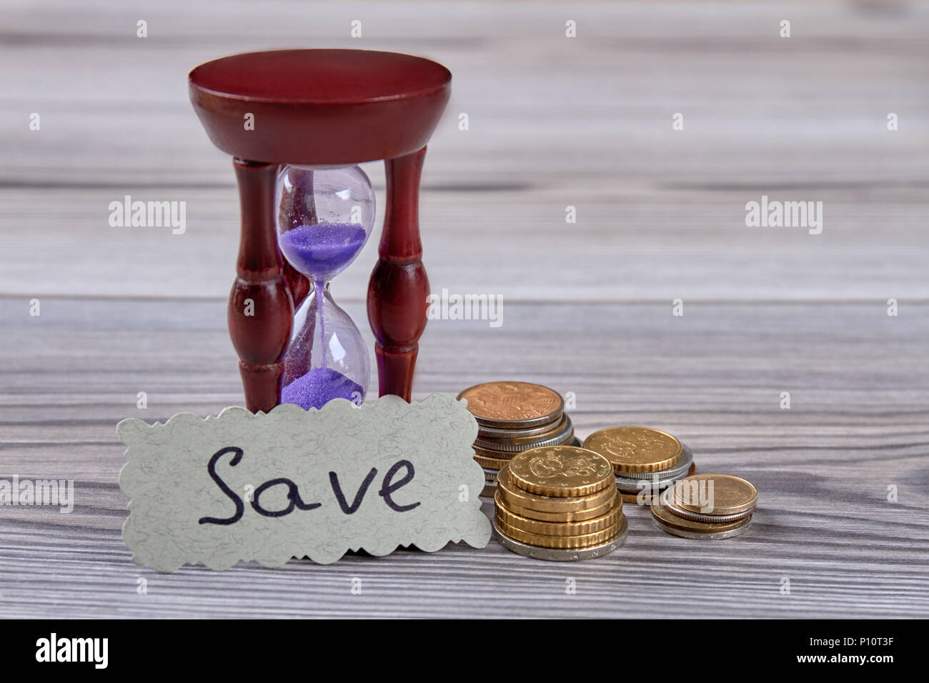 Hourglass time saving hi-res stock photography and images - Alamy