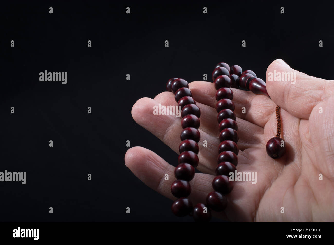 Set of some praying beads of various colors in hand Stock Photo - Alamy