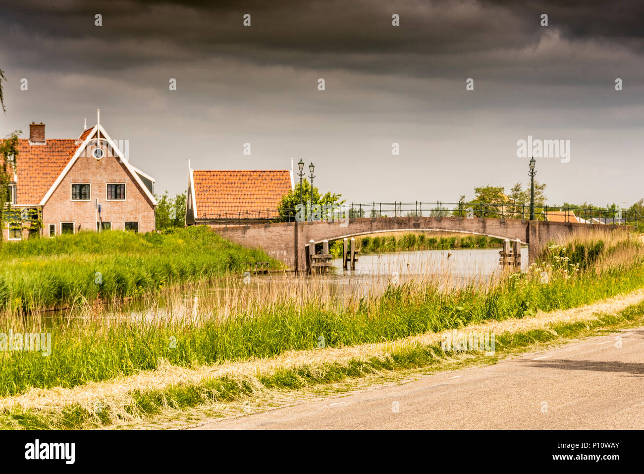 Typical canal landscape and bridge entrance to rural village in the ...