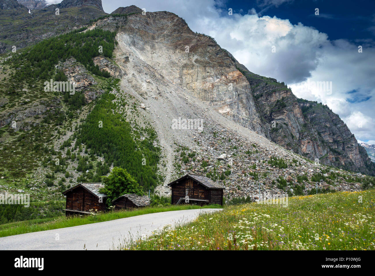 Wooden barns and meadows at the Scene of the 1991 rockfall, landslide ...