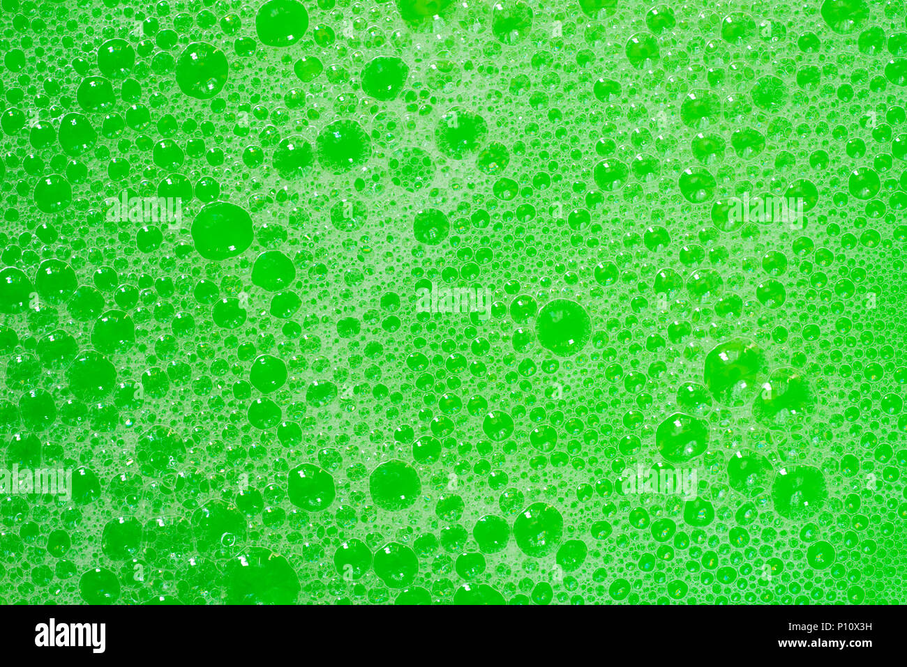 green washing liquid with bubbles background Stock Photo - Alamy