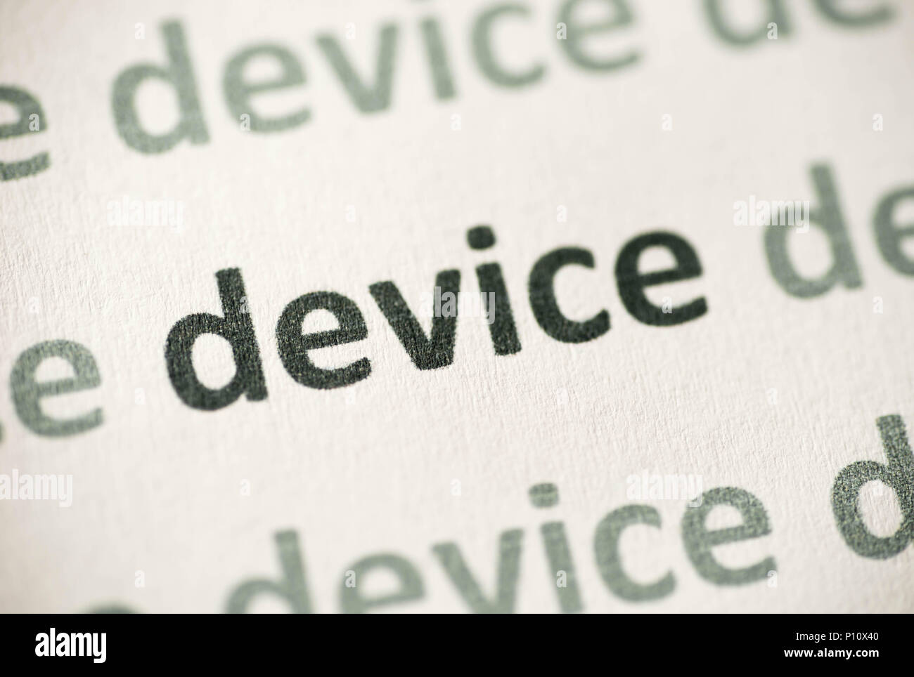 word device printed on white paper macro Stock Photo - Alamy