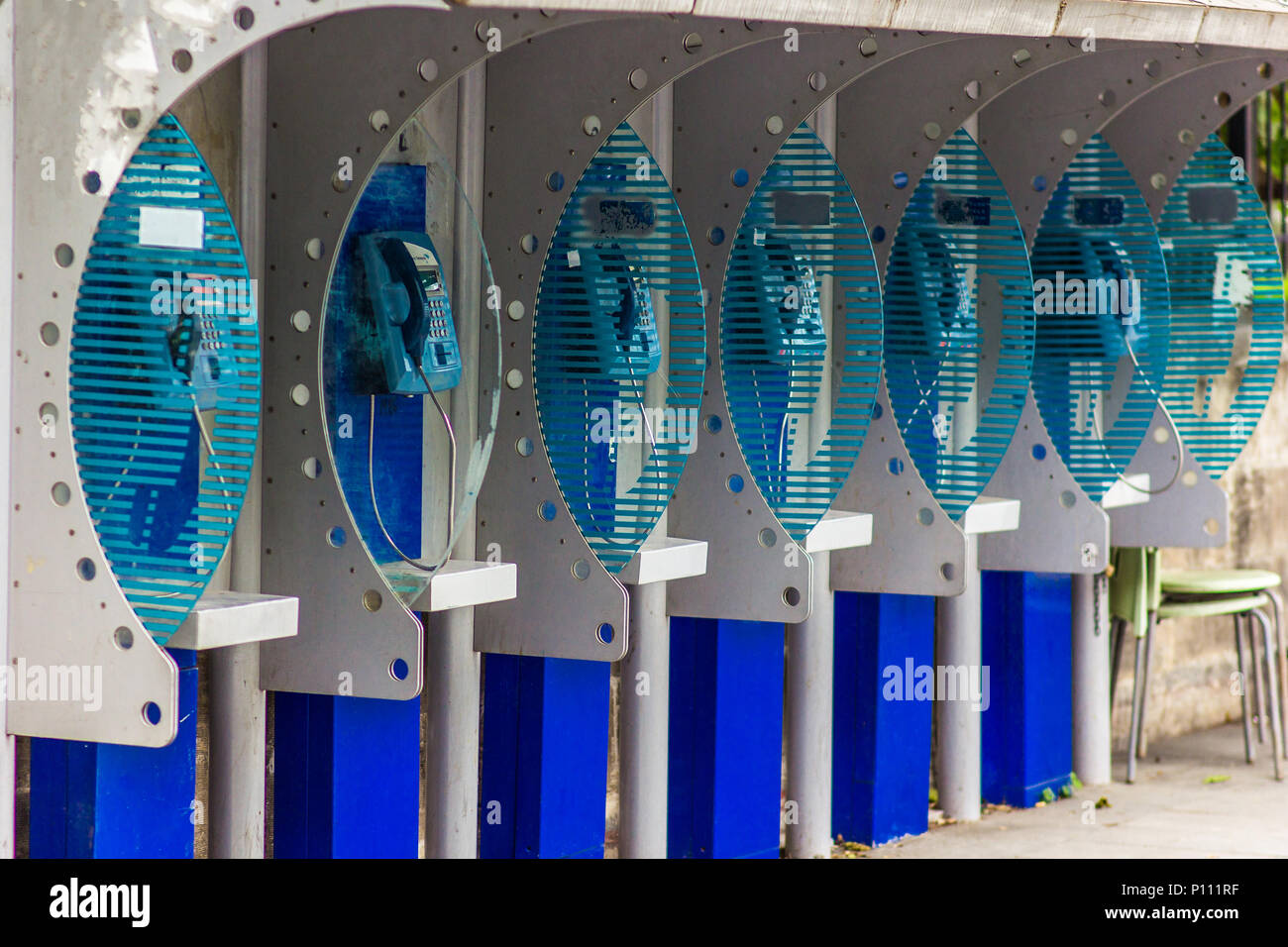 Old blue public phone booths in town Stock Photo - Alamy