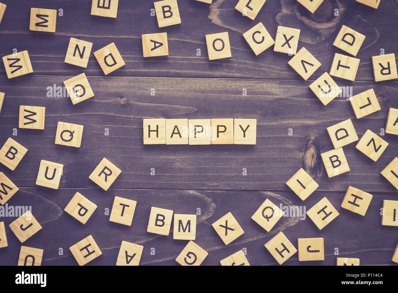 Happy word wood block on table for business concept Stock Photo - Alamy