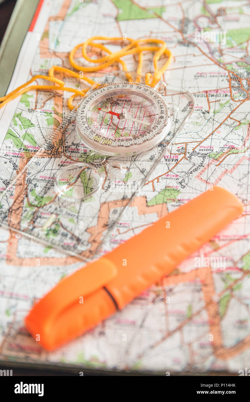 A compass and an orange marker on a map Stock Photo - Alamy