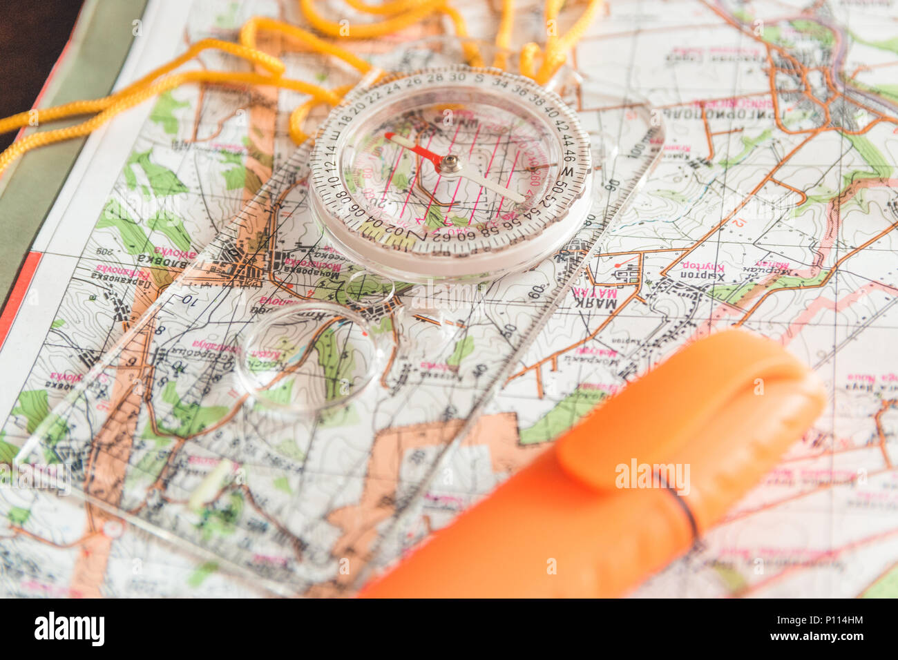 A compass and an orange marker on a map Stock Photo - Alamy