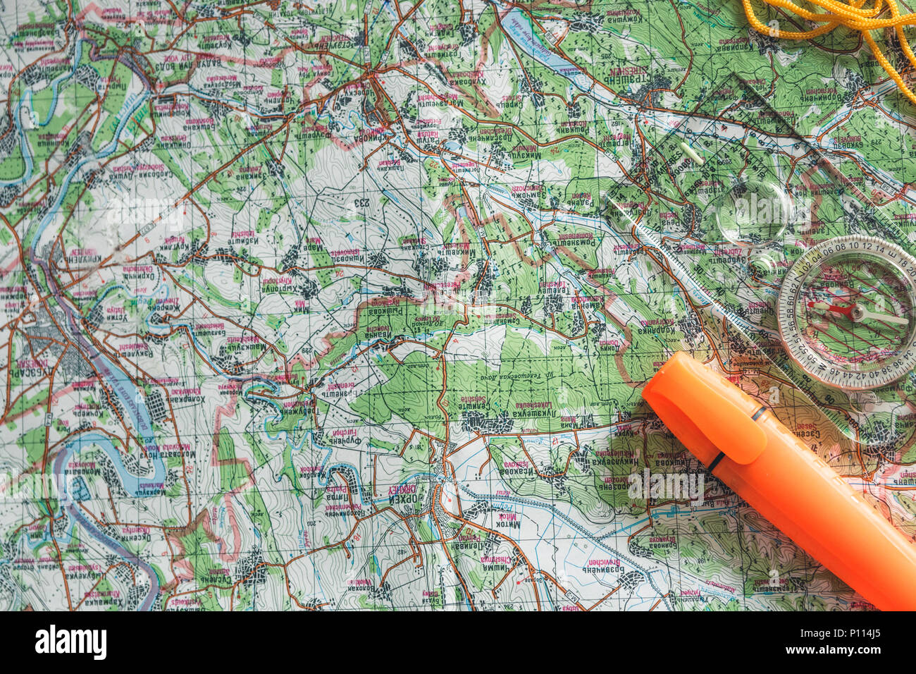A compass and an orange marker on a map Stock Photo - Alamy