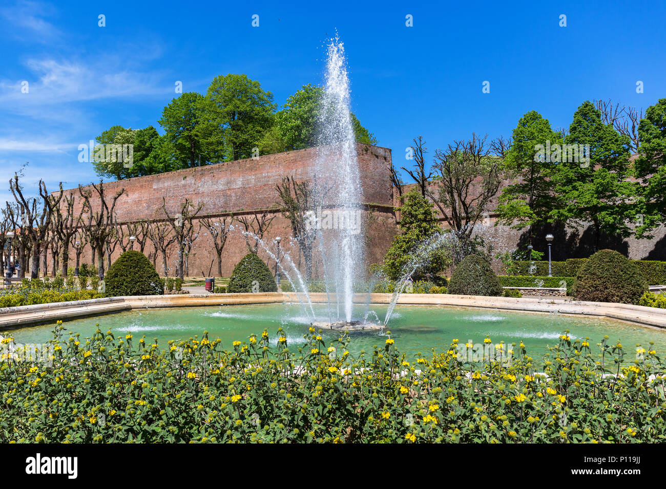 Tranquil garden scene fountain flowers hi-res stock photography and ...