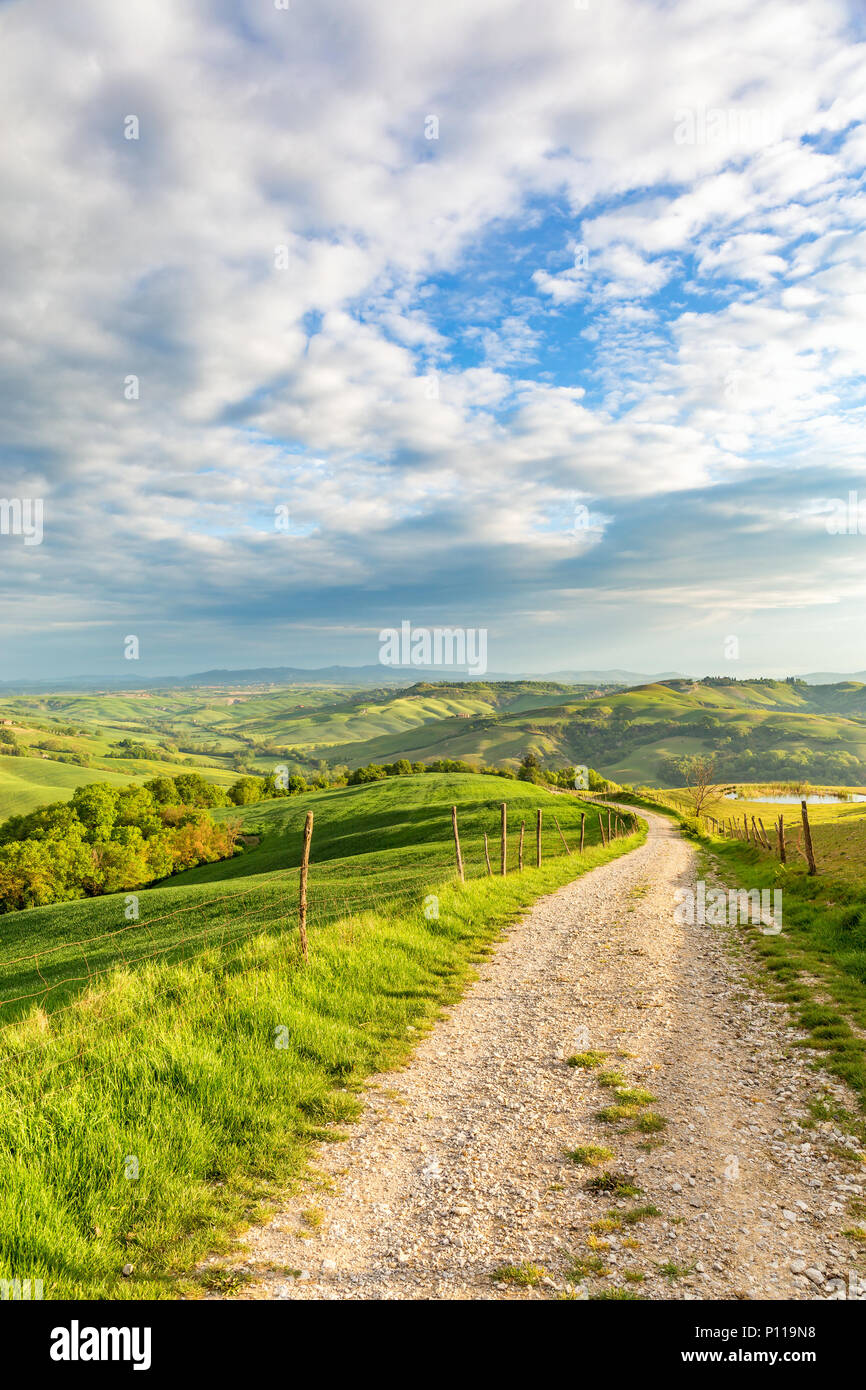 Dirt road in a rural rolling countryside Stock Photo - Alamy