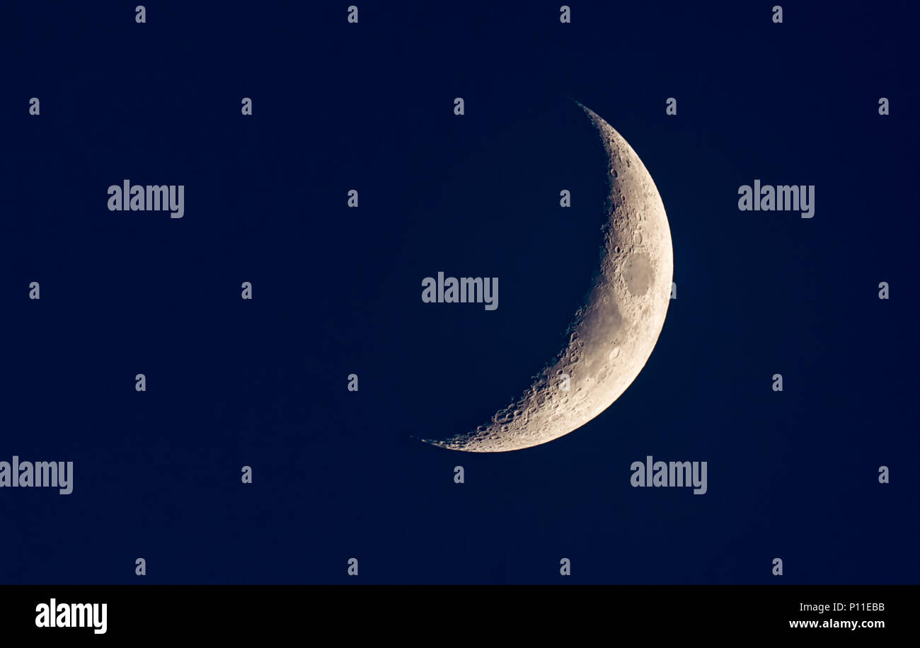 crescent moon large in a dark night sky Stock Photo - Alamy