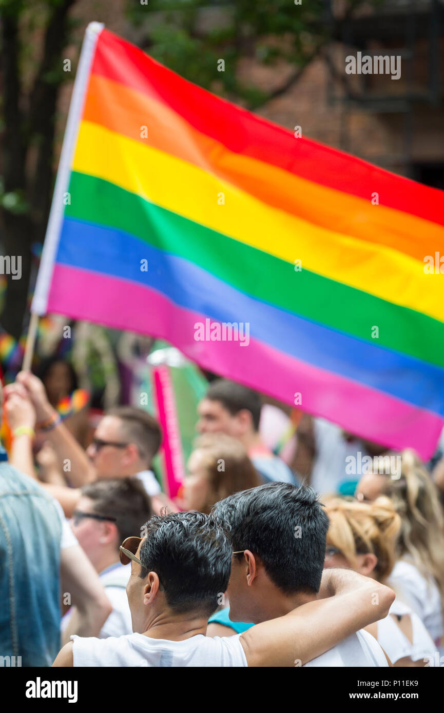NEW YORK CITY - JUNE 25, 2017:Participants wave rainbows flags in the ...