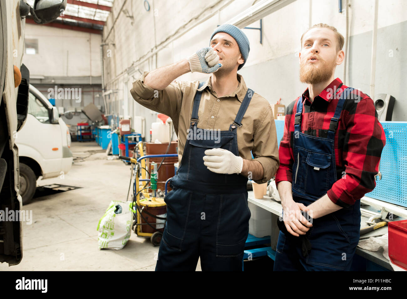Young Auto Technicians At Work Stock Photo - Alamy