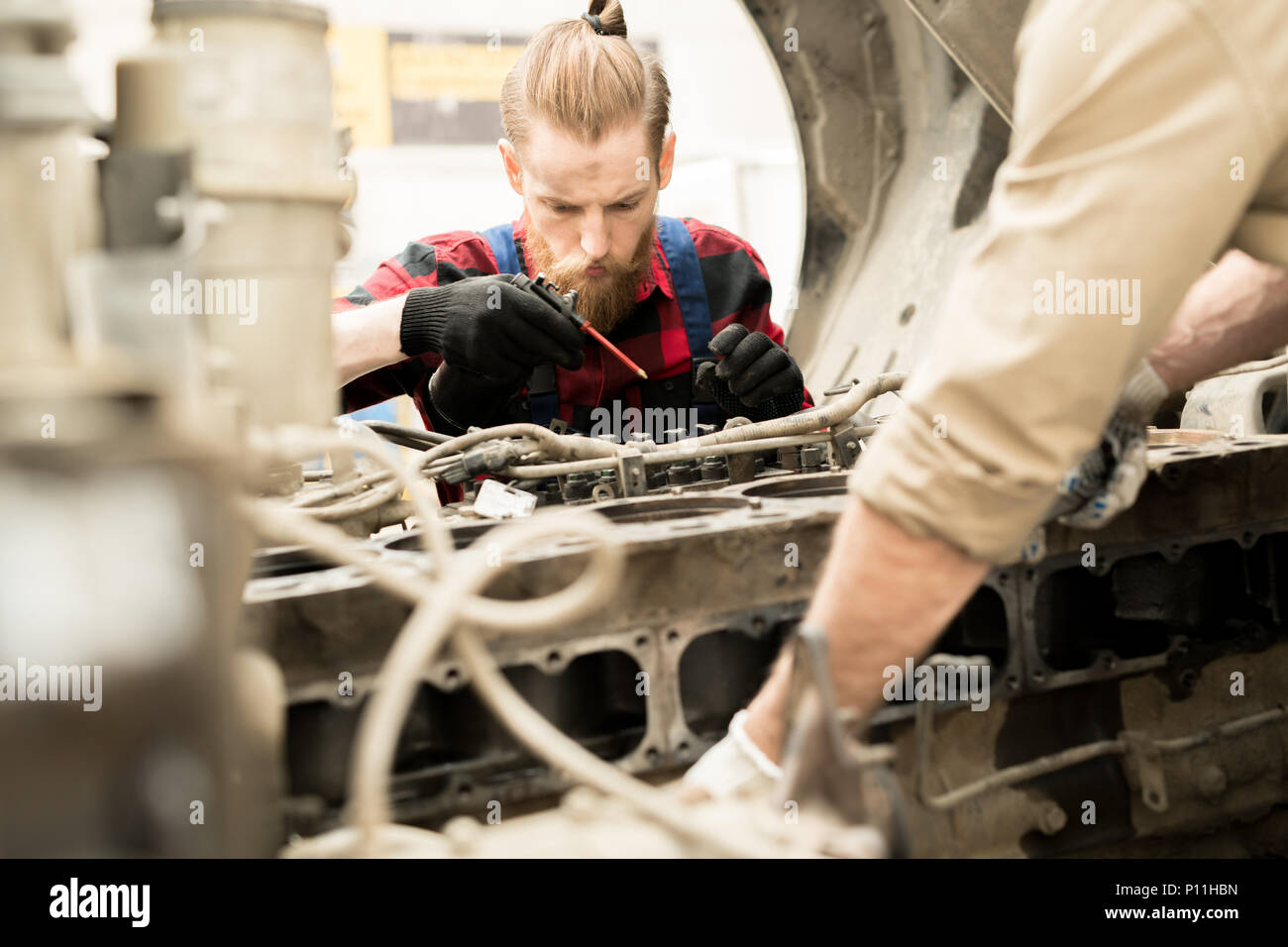 Mechanic Repairing Vehicle Stock Photo - Alamy