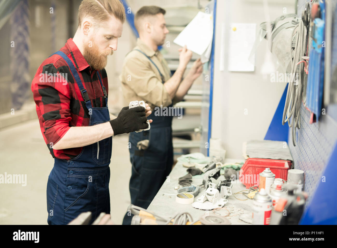 Mechanics Working In Repair Shop Stock Photo - Alamy