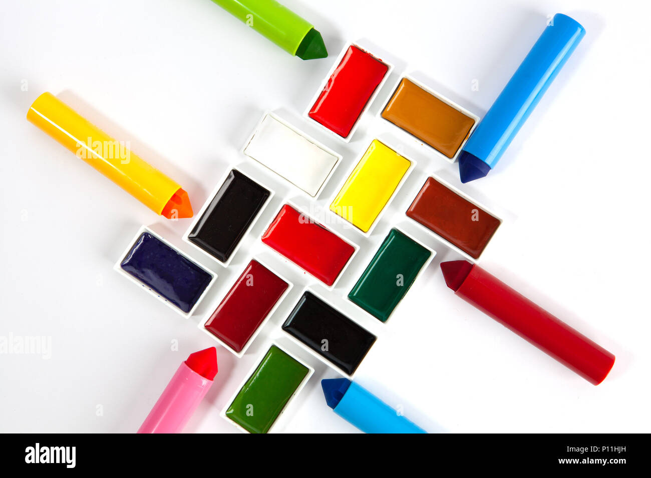 Art supplies background - watercolor pans and chunky big markers ...