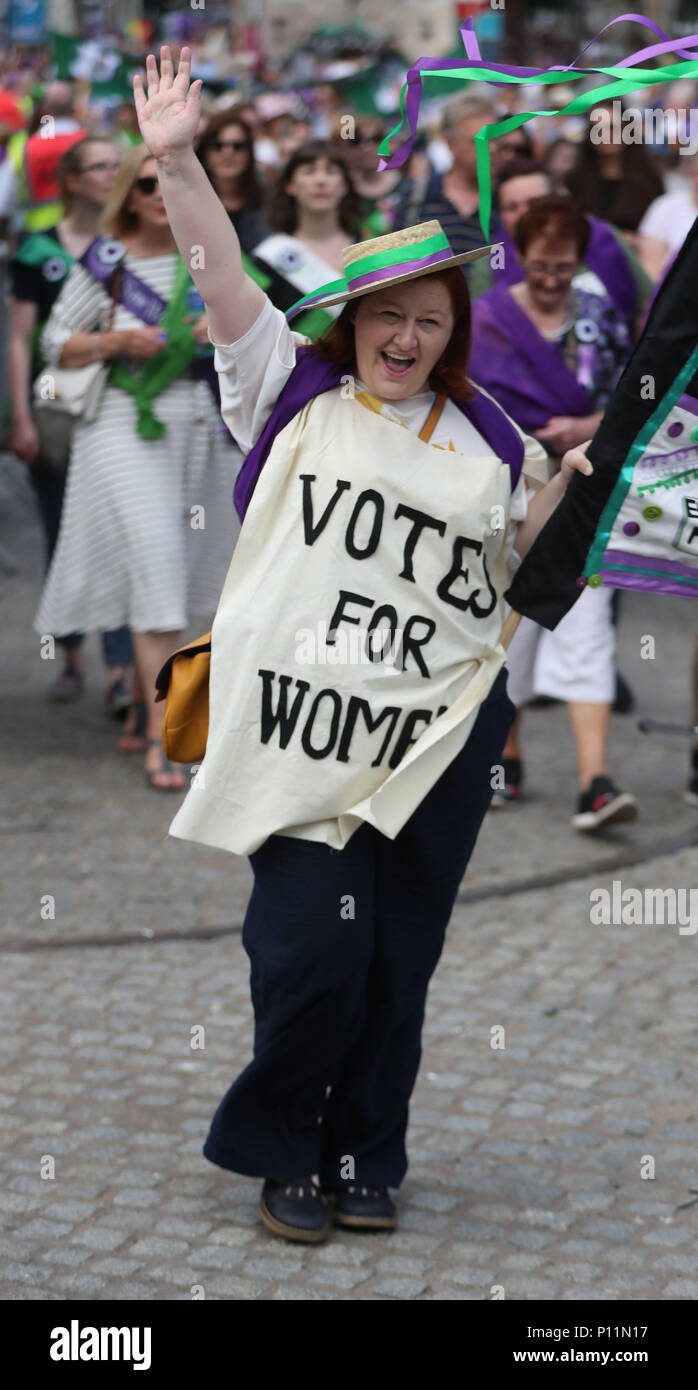 Women take part in the Processions' artwork march, in Belfast, as they ...