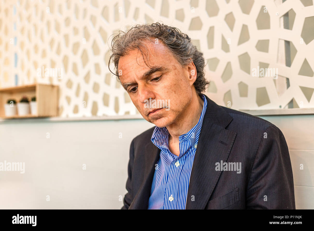 mature man with tanned and aged sagging skin with wrinkles and spots ...