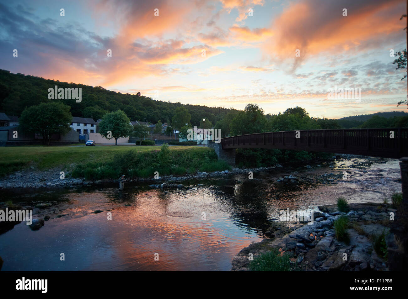 Man fly fishing on the River Leven at Newby Bridge at Dusk, The Lake ...