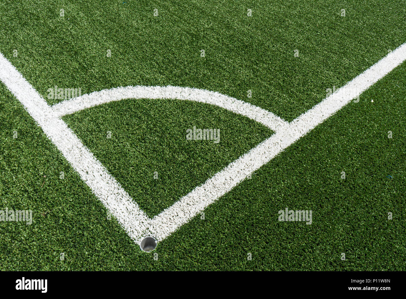 corner lines of football soccer field on plastic green Stock Photo - Alamy