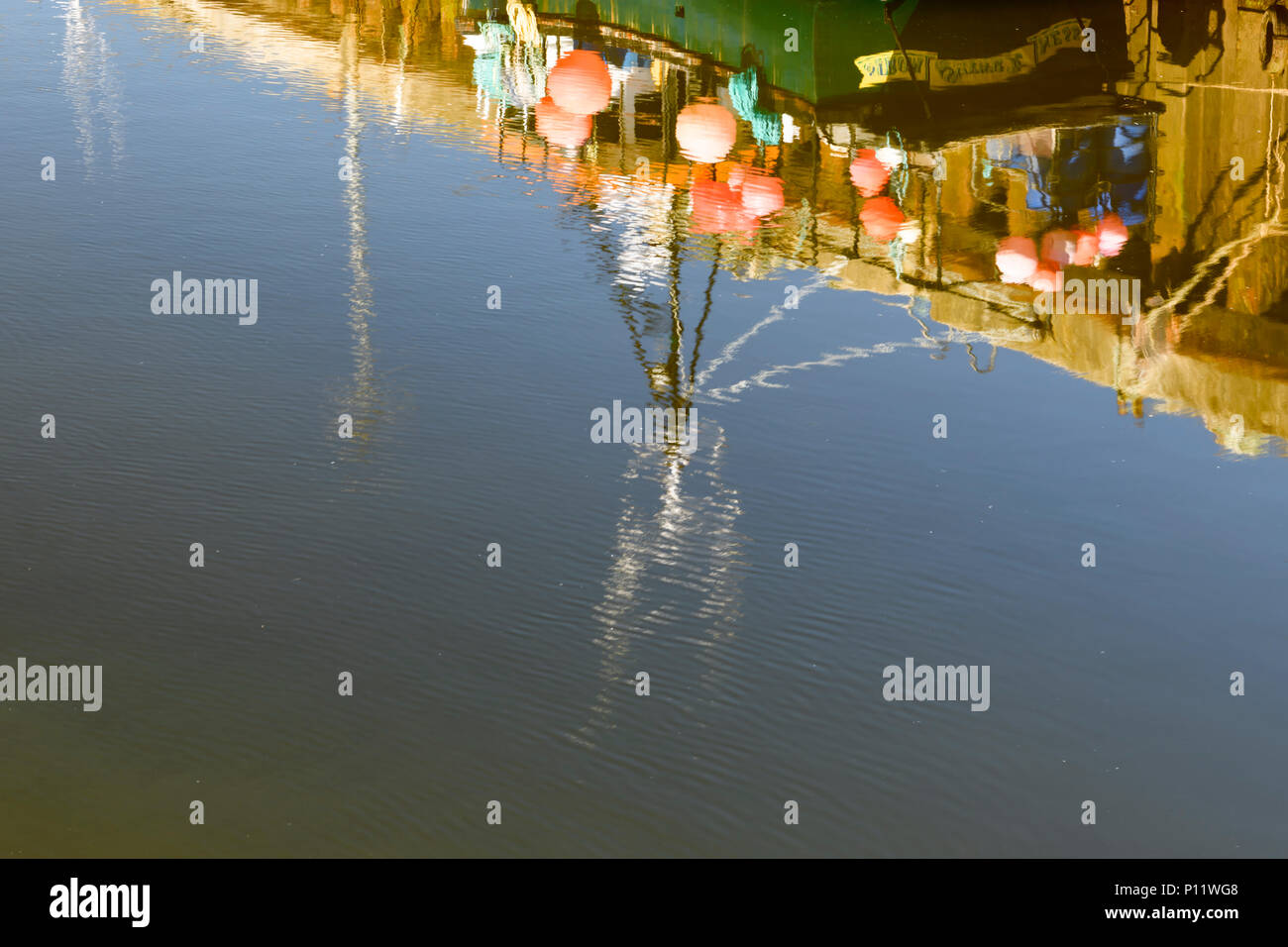 Boat reflections in water at lybster harbour, Caithness, Scotland. 24 ...