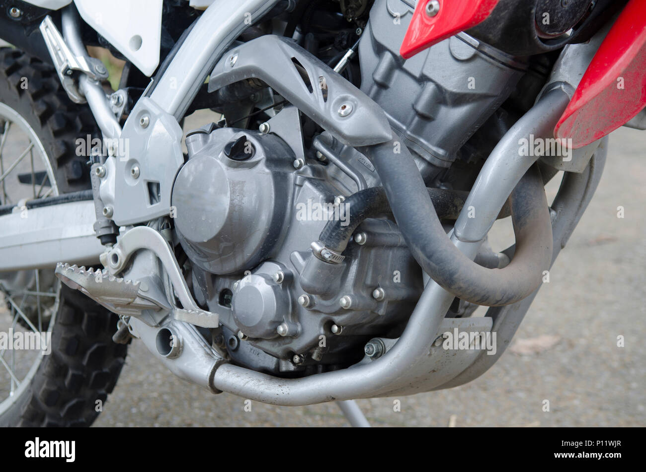 Motorcycle engine closeup at field of racing Stock Photo - Alamy