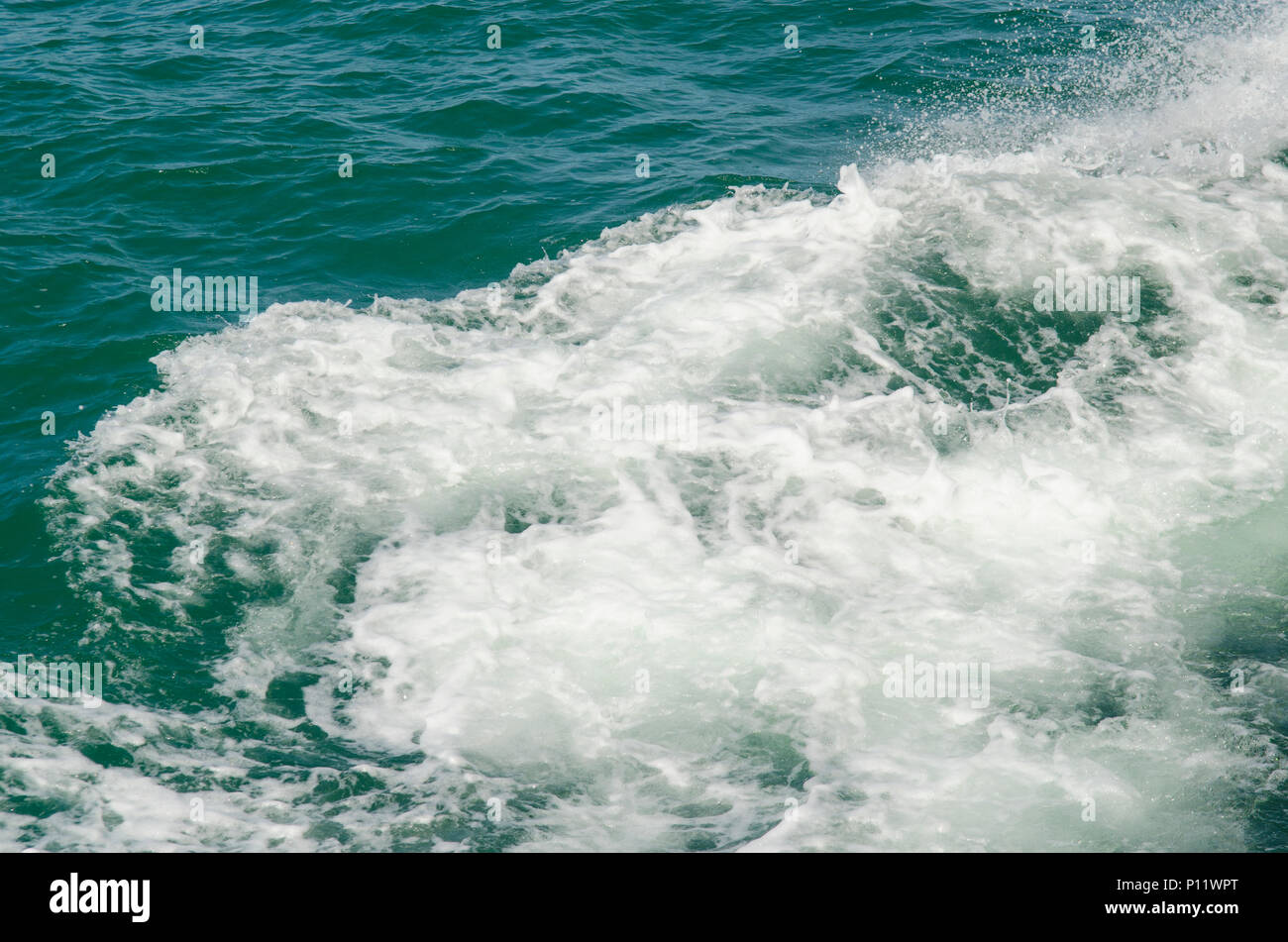 Boat wake on the water near the boat Stock Photo - Alamy