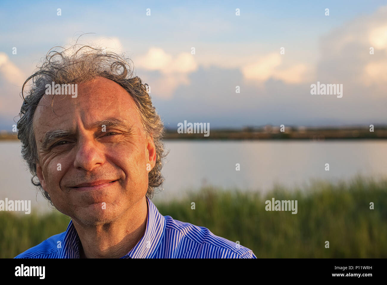 mature man with tanned and aged sagging skin with wrinkles and spots ...