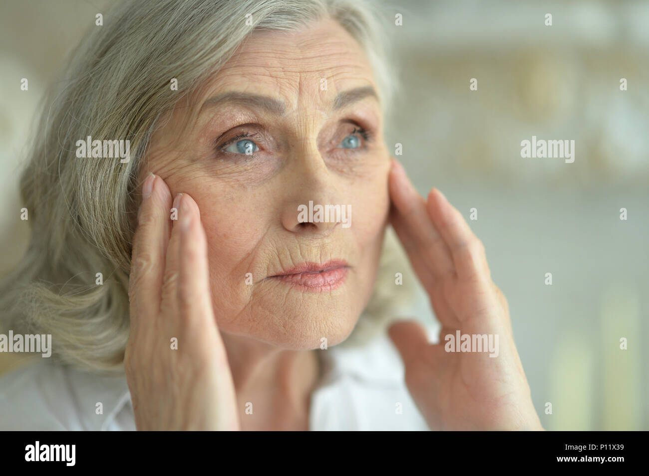 beautiful Sad senior woman Stock Photo - Alamy