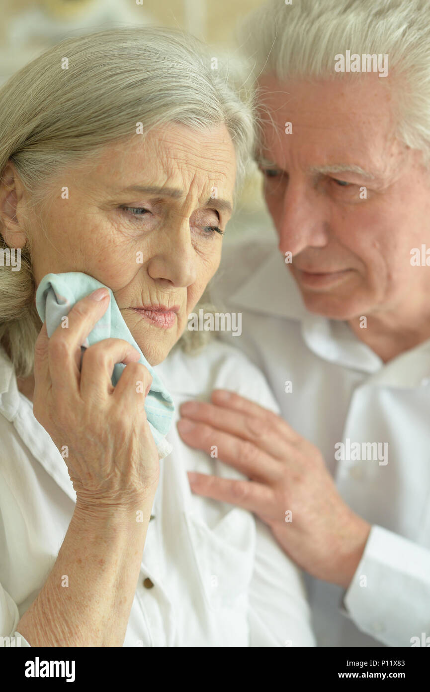 man holding hand on cheek Stock Photo - Alamy