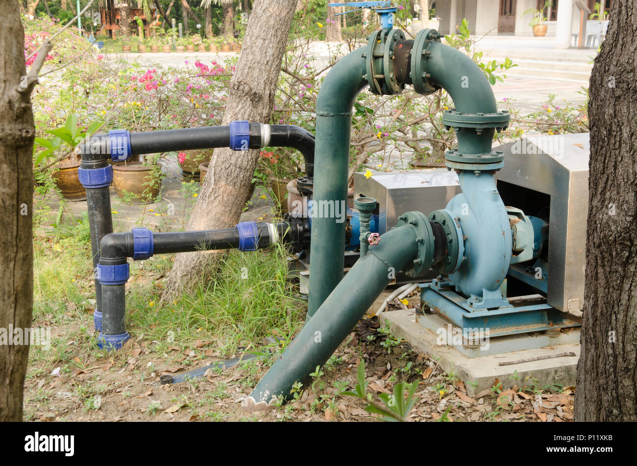 water pumping on the ground field Stock Photo - Alamy