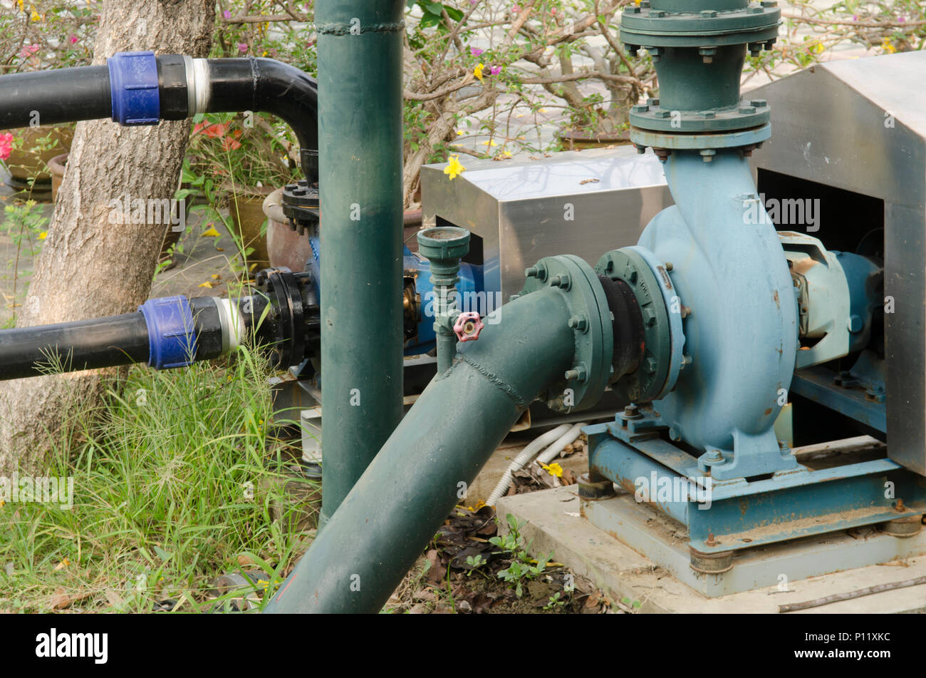 water pumping on the ground field Stock Photo - Alamy