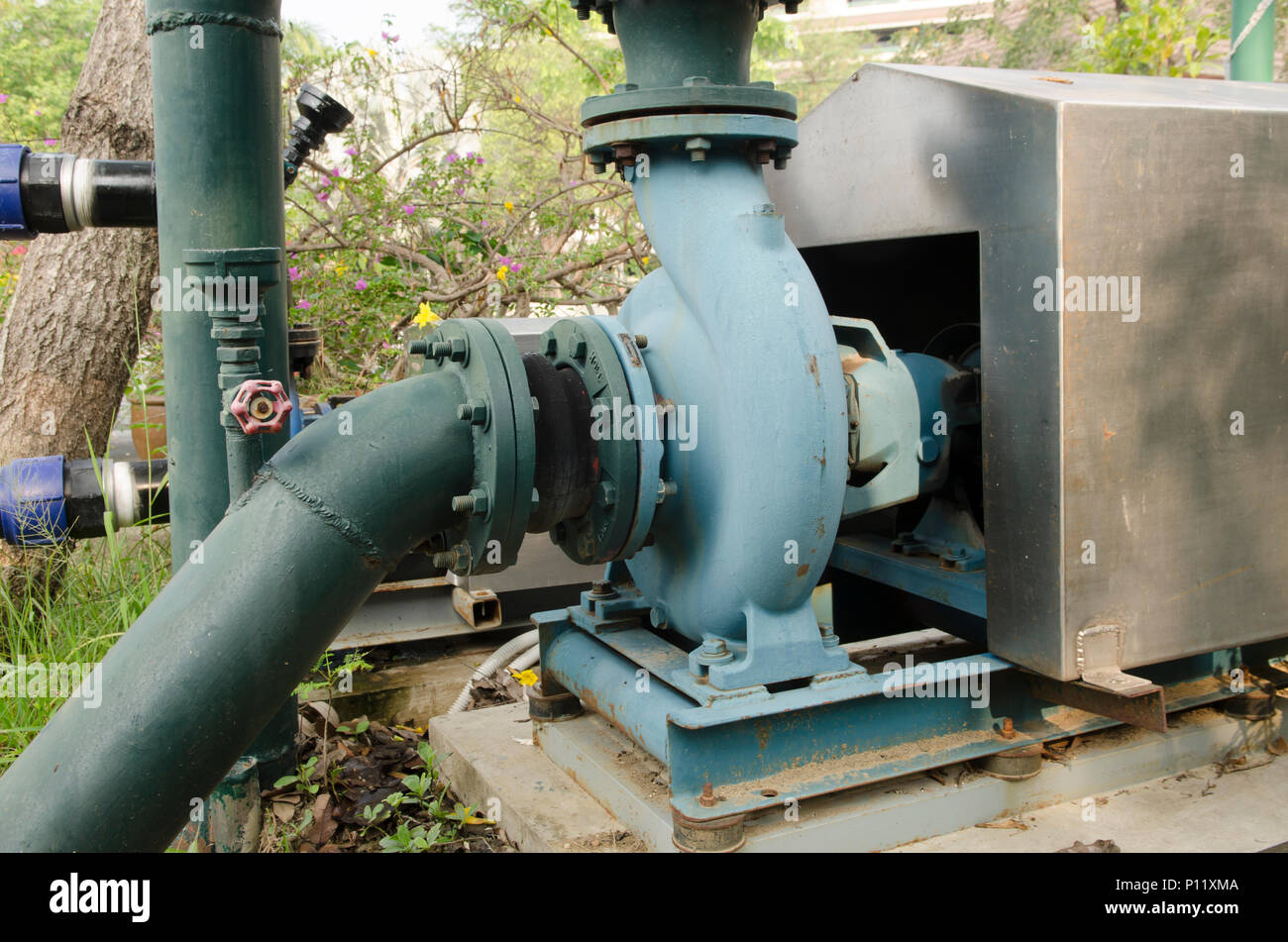water pumping on the ground field Stock Photo - Alamy
